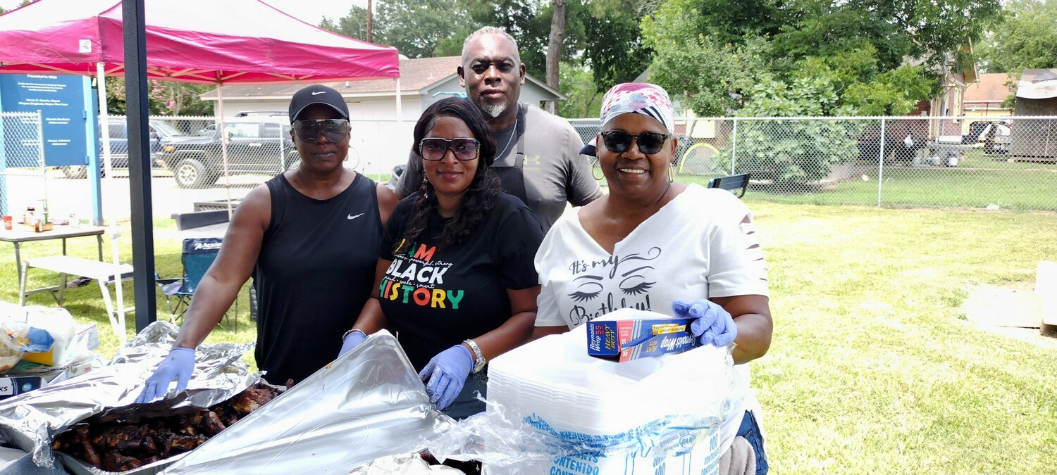 Members of the Brookshire I-10 West group prepare a barbeque cookout at ...
